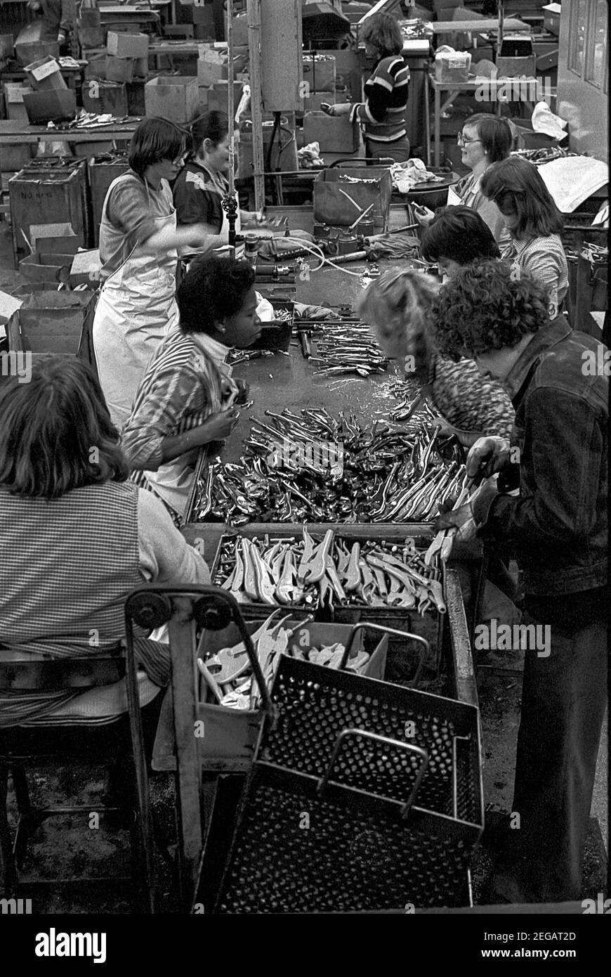 Group of Women Sorting Parts in a Wrench Factory Stock Photo - Alamy