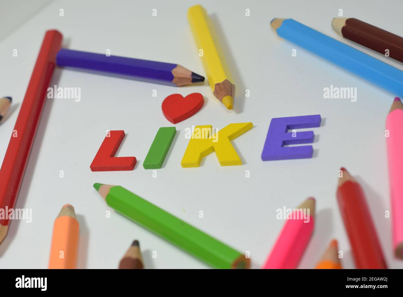 LIKE Colourful wording and Colour Pencils Isolated With White ...