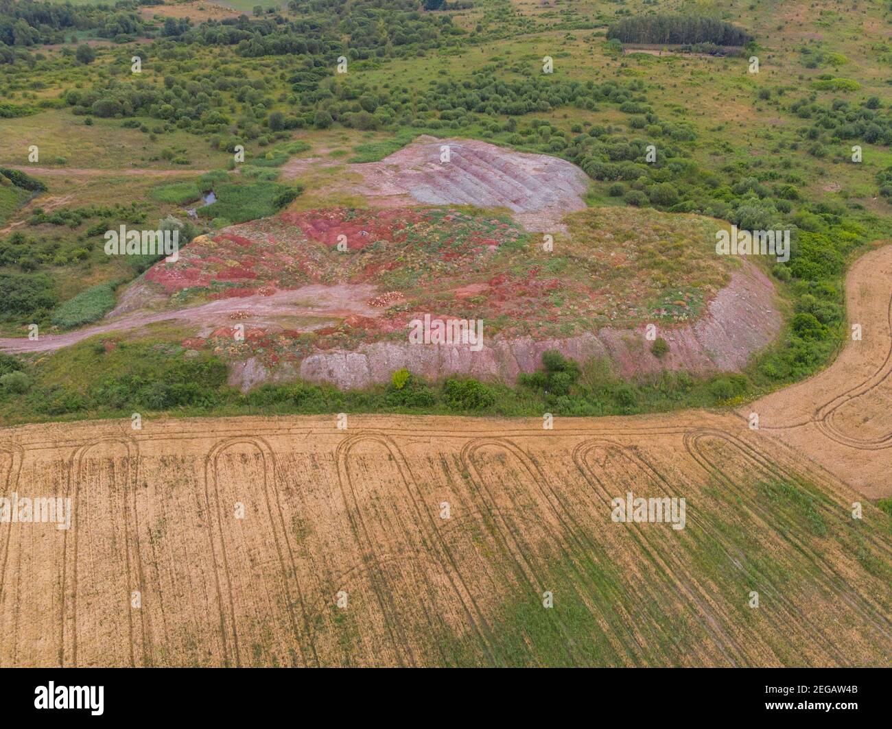 Aerial look to hill near fields and bushes Stock Photo - Alamy
