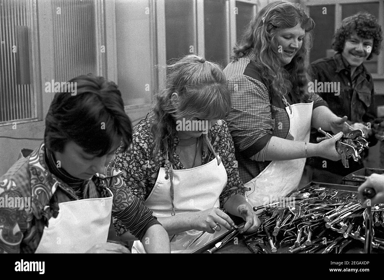 Group of Women Sorting Parts in wrench Factory Stock Photo - Alamy