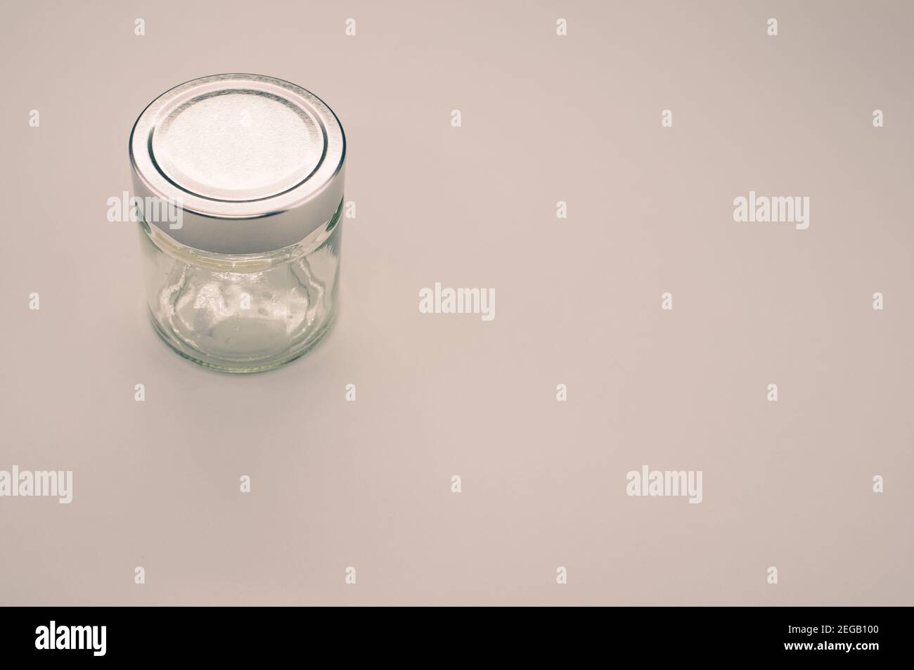 Top view of an empty glass jar with a silver lid isolated on ...