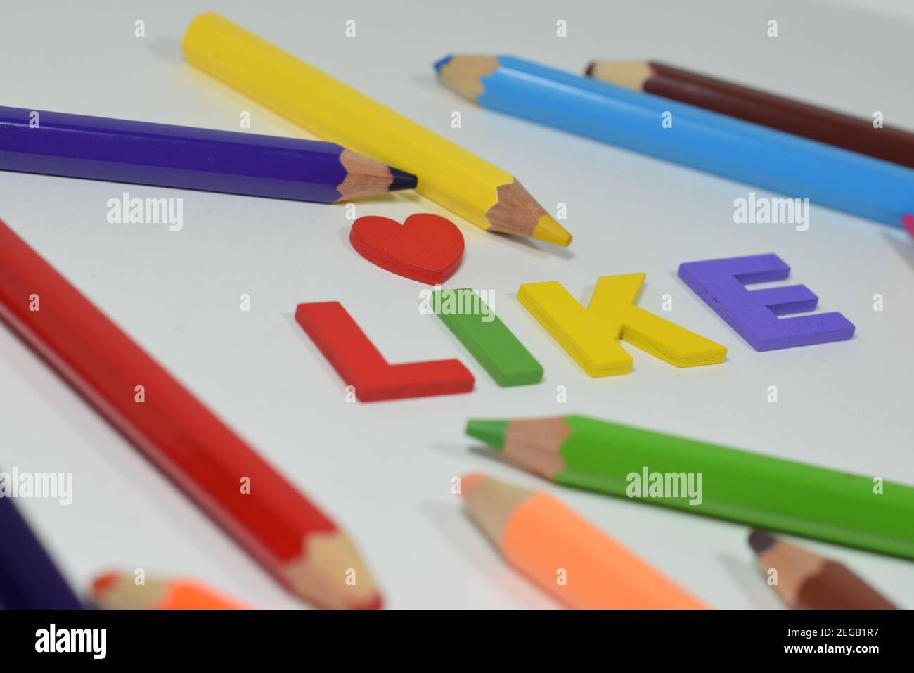 LIKE Colourful wording and Colour Pencils Isolated With White ...