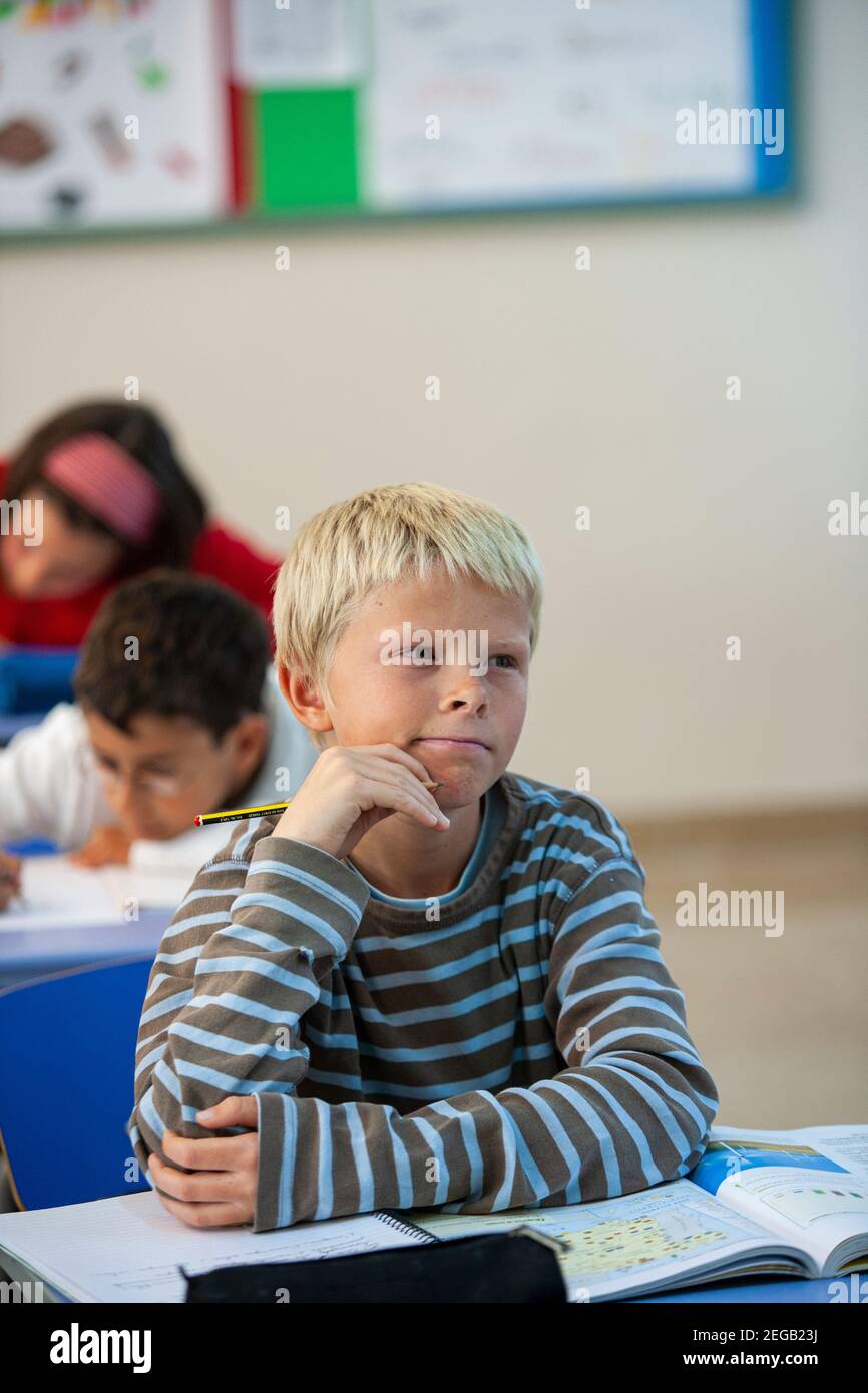 Young boy in the school classroom Stock Photo - Alamy