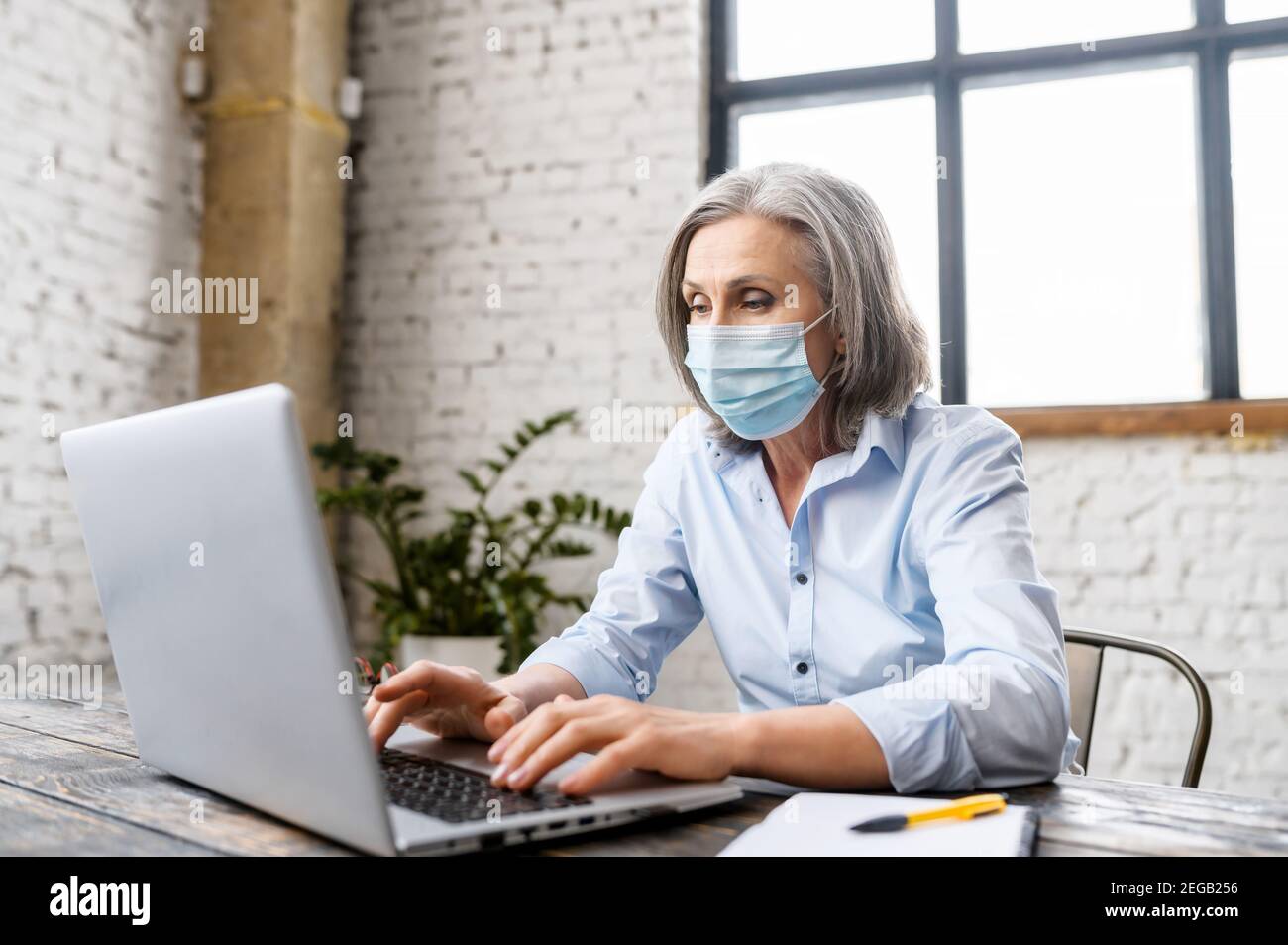 Mature woman wearing facial mask hi-res stock photography and images ...
