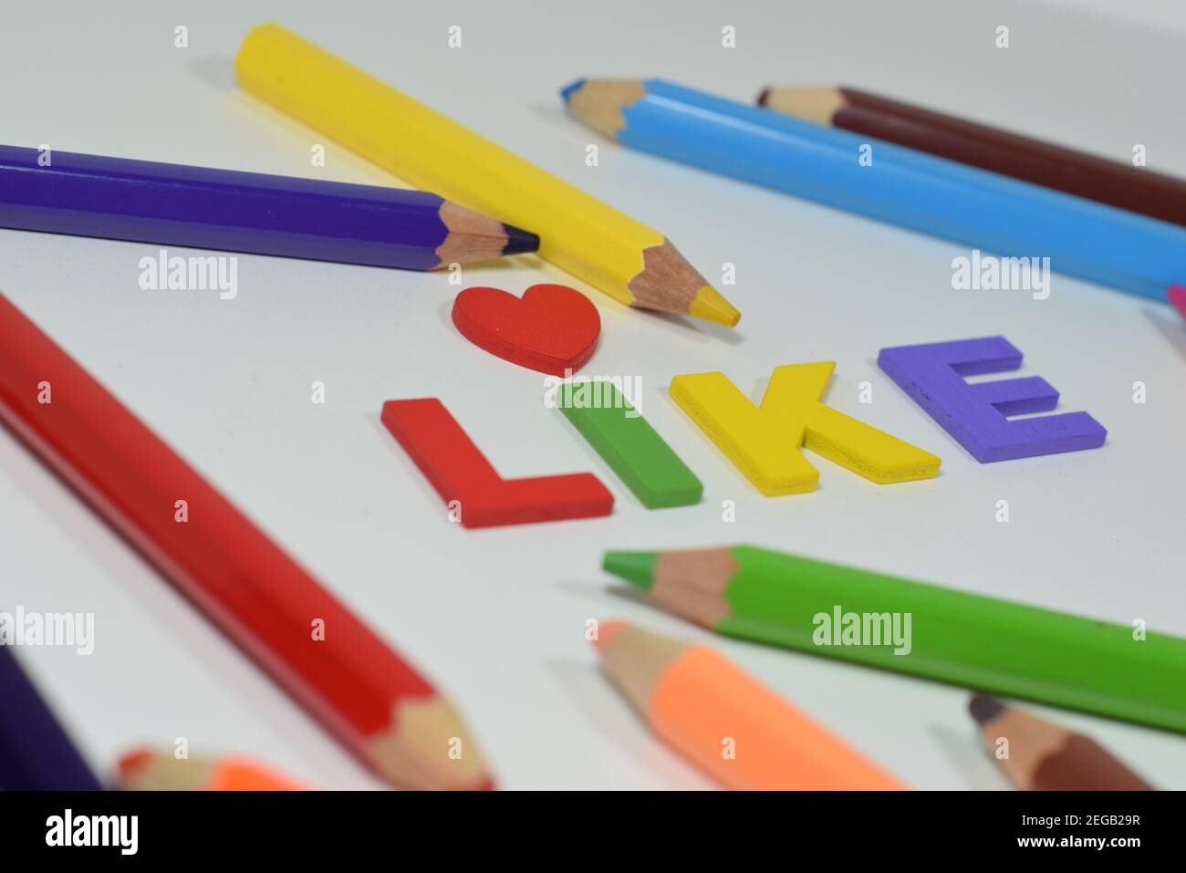 LIKE Colourful wording and Colour Pencils Isolated With White ...