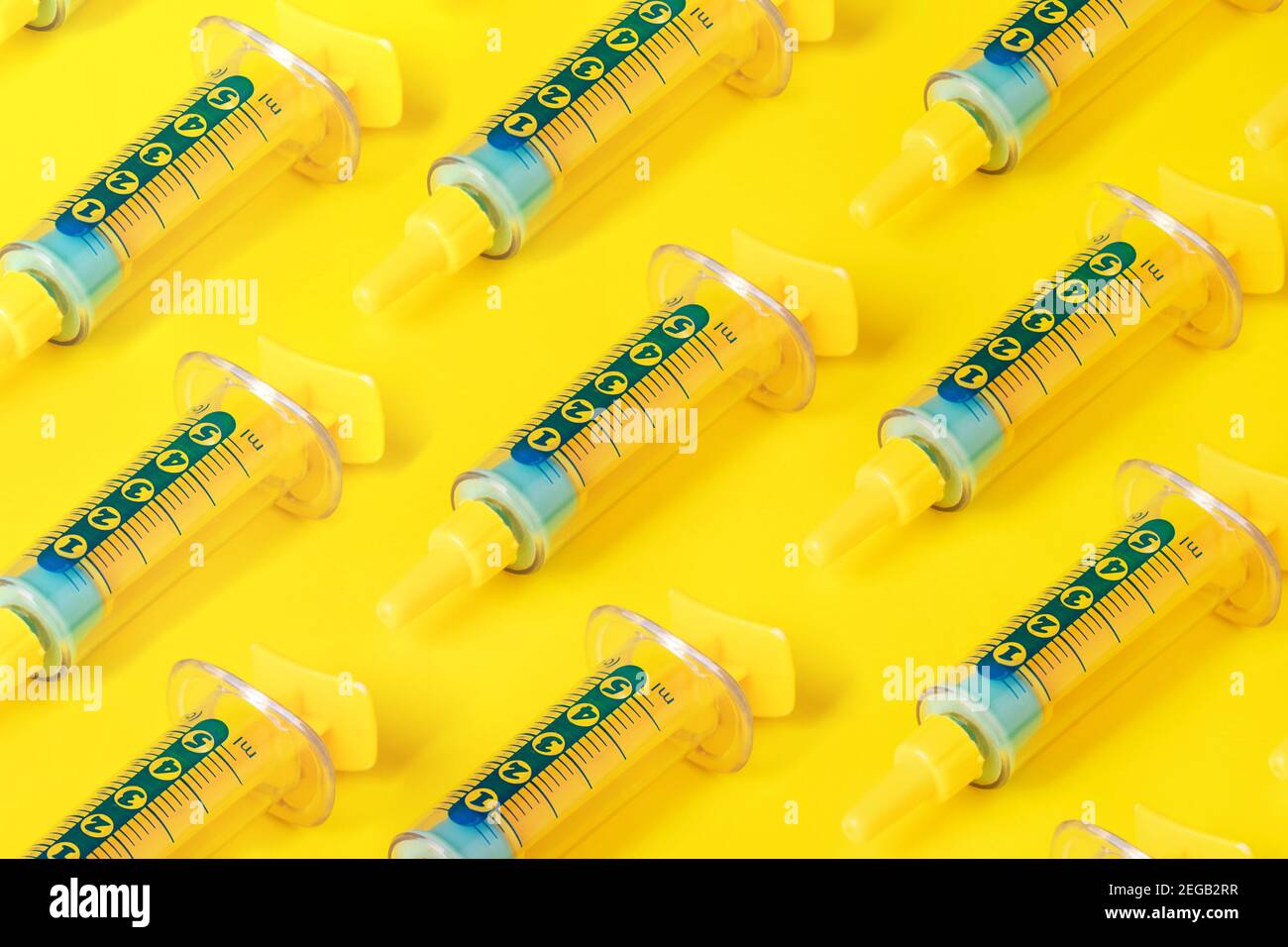 syringe pattern over yellow background, concept medicine Stock Photo ...