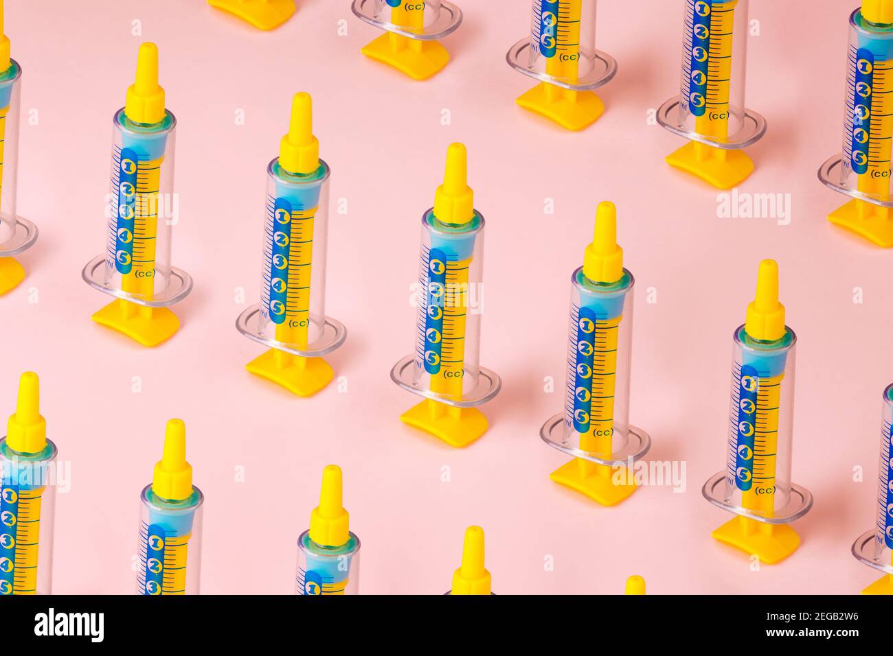 syringe pattern over pink background, concept vaccine Stock Photo - Alamy