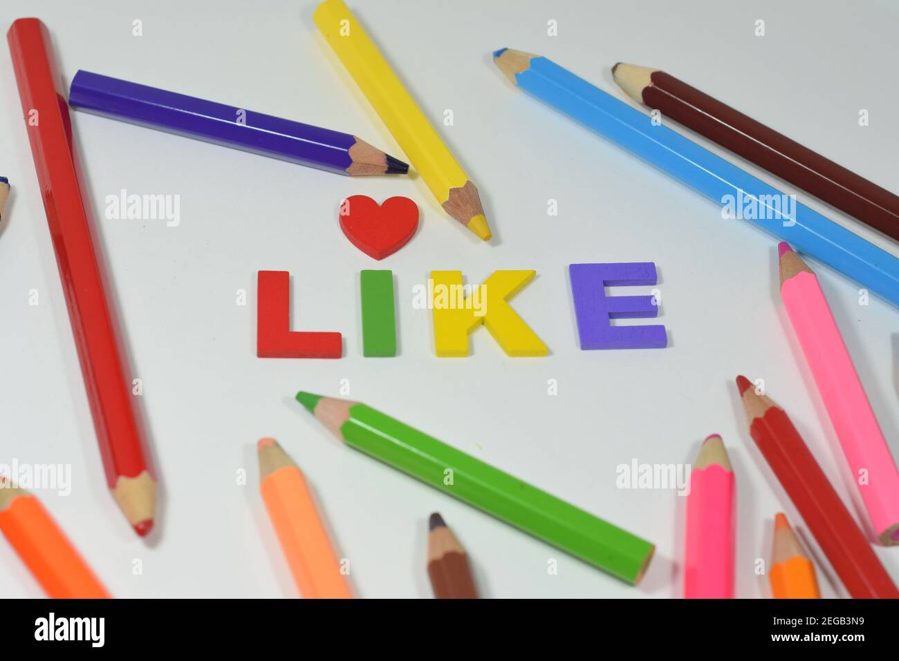 LIKE Colourful wording and Colour Pencils Isolated With White ...