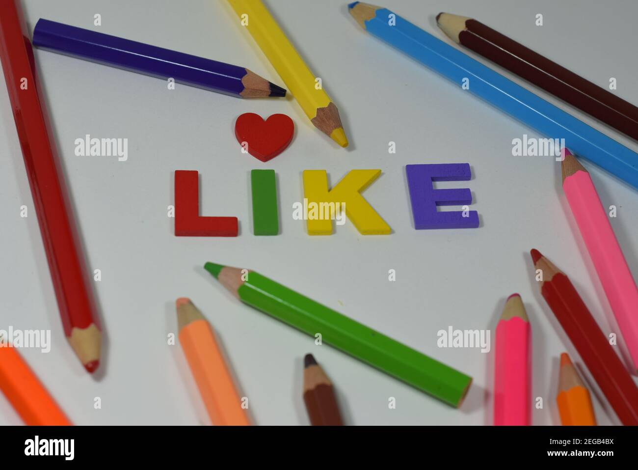 LIKE Colourful Wording and Colour Pencils Isolated With White ...