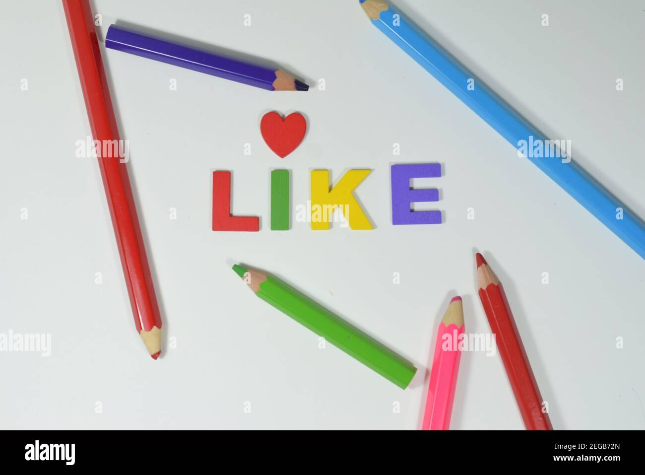 LIKE Colourful wording and Colour Pencils Isolated With White ...