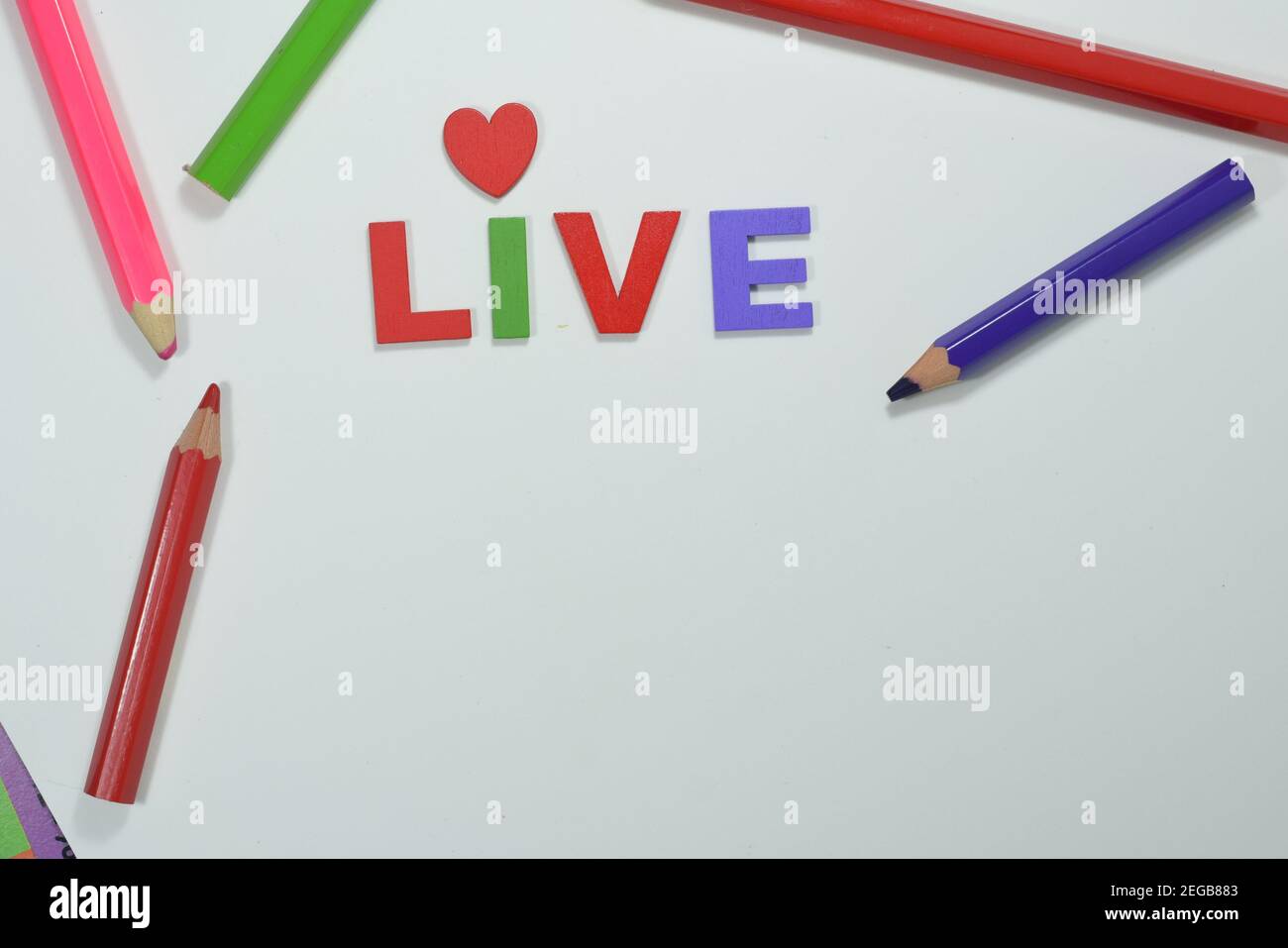 LIVE wording and Colour Pencils Isolated With White Background Stock ...
