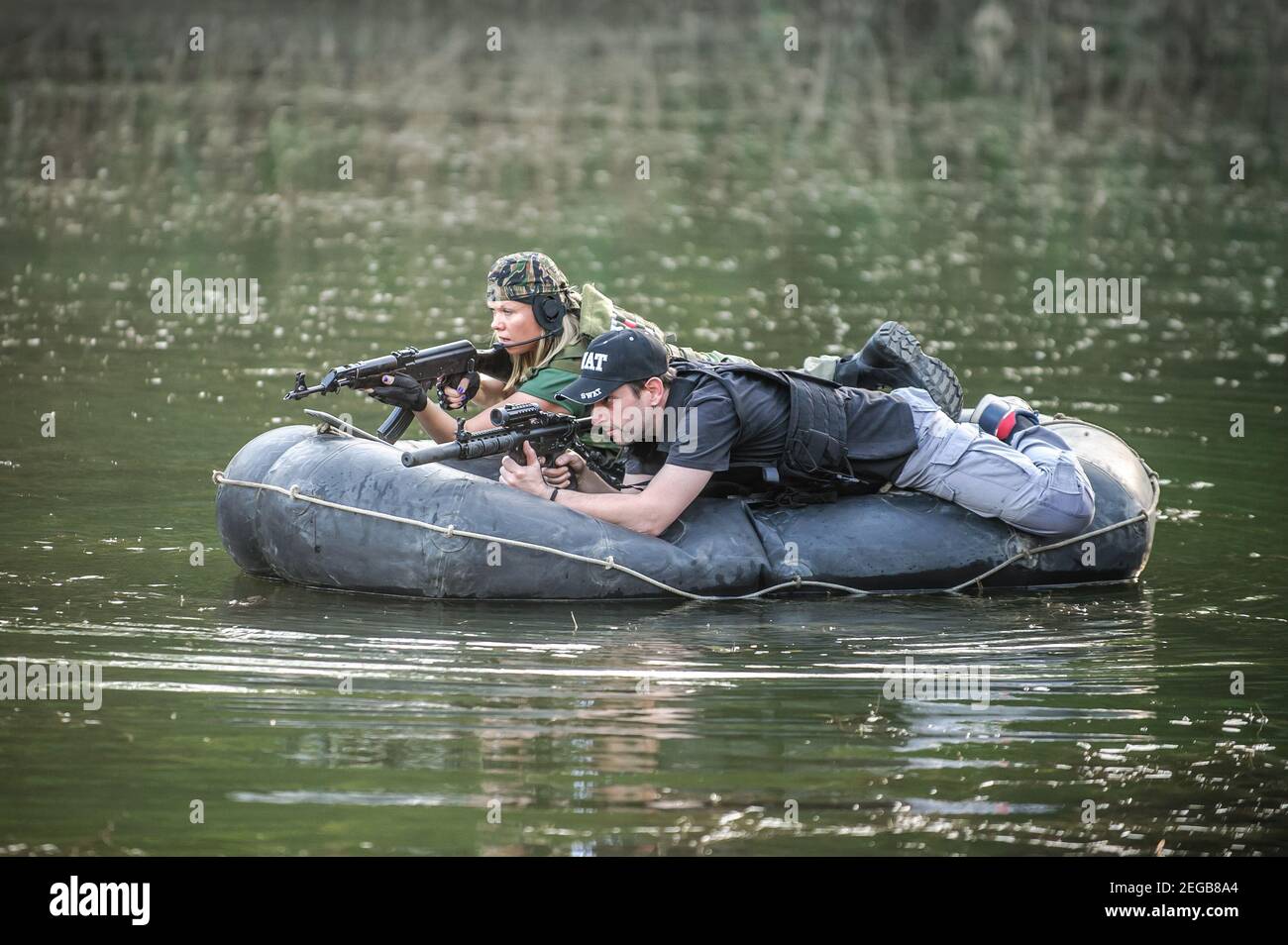 Soldier training. Special forces in camouflage uniforms paddling ...
