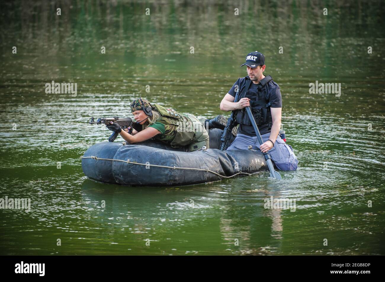 Soldier training. Special forces in camouflage uniforms paddling ...