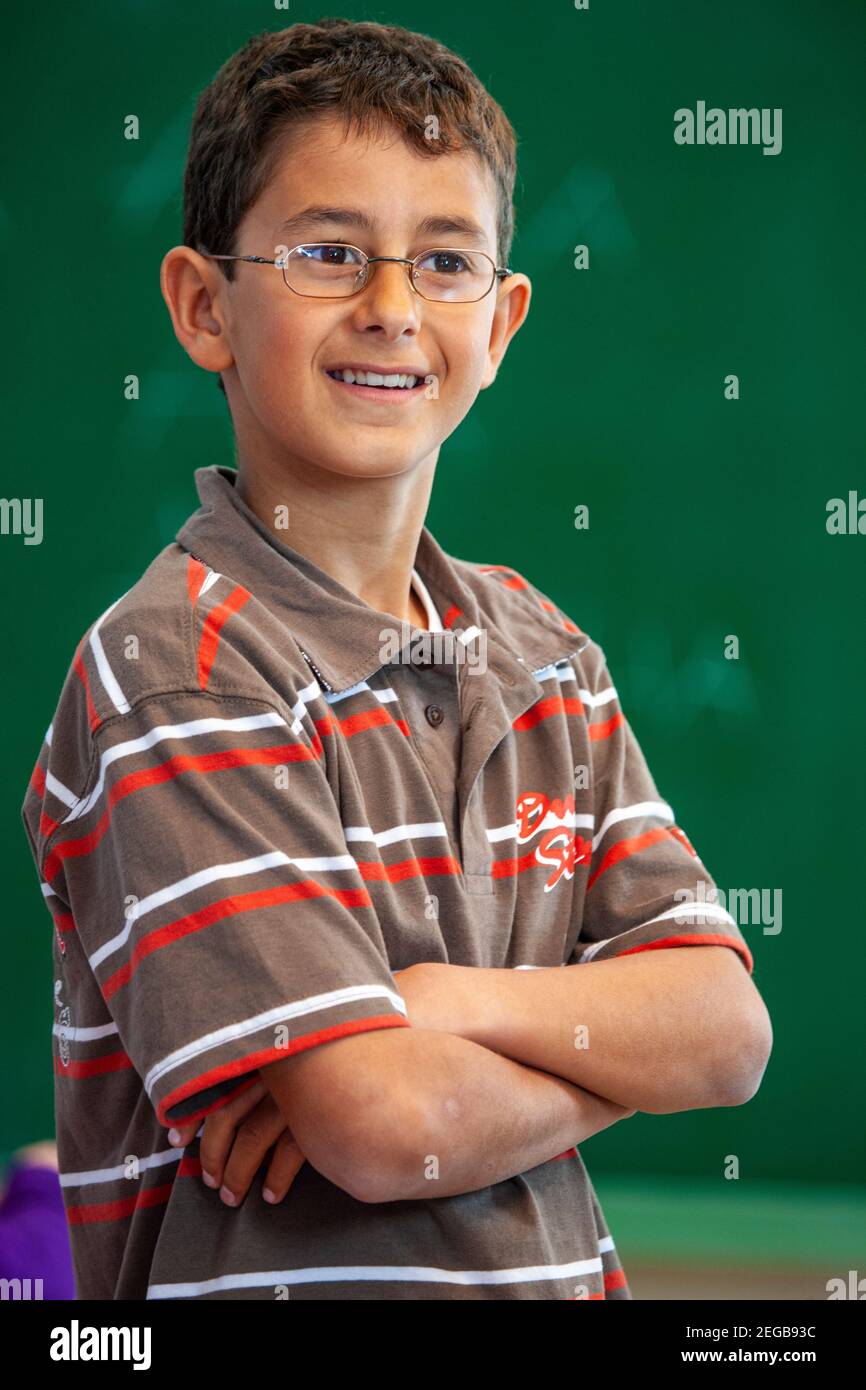 Portrait of a young schoolboy in a classroom Stock Photo - Alamy