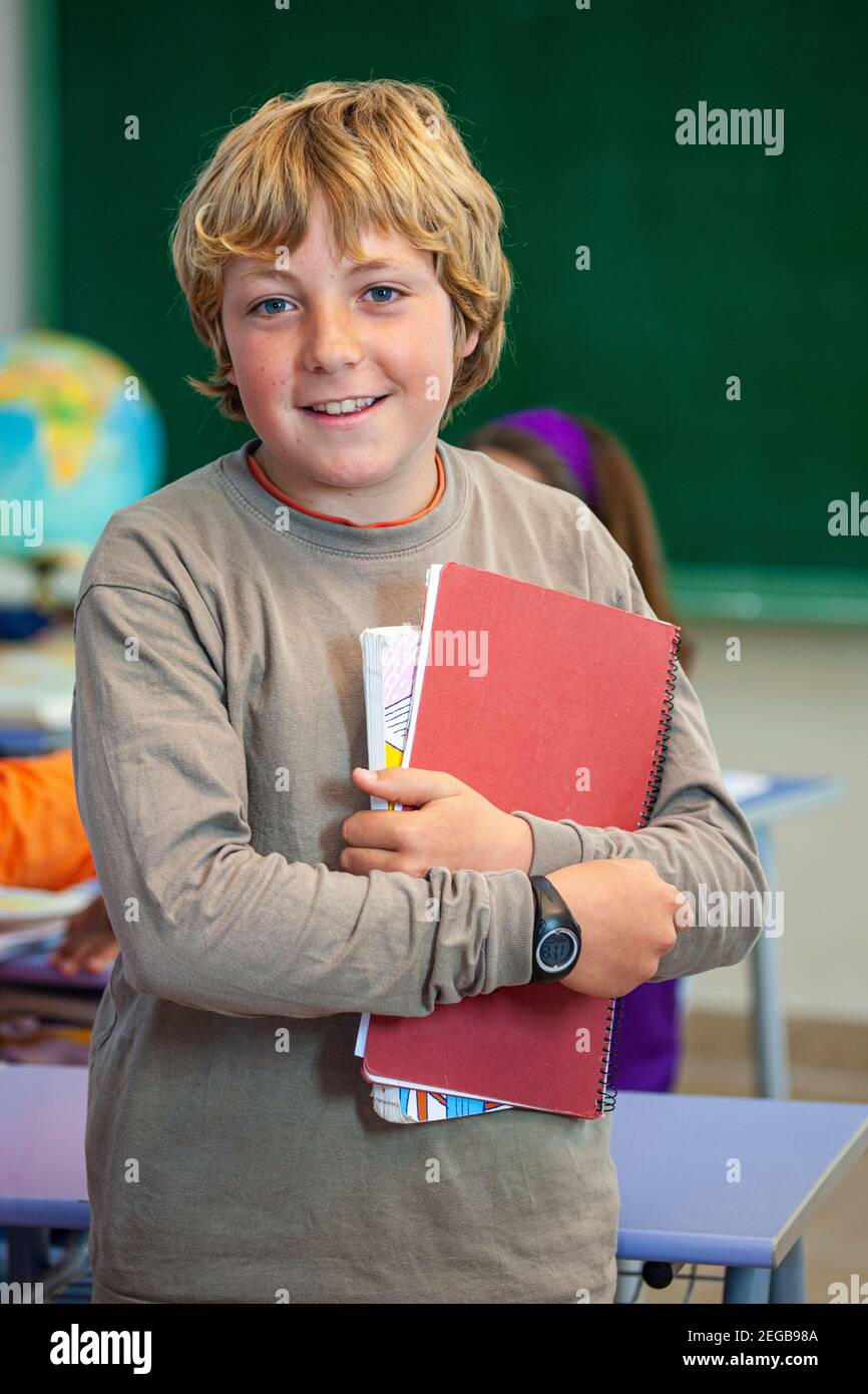 Portrait of a young schoolboy in a classroom Stock Photo - Alamy