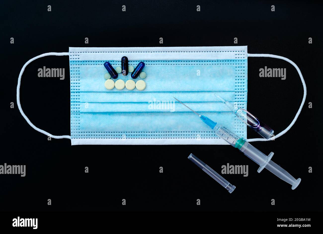 medical face mask, capsules, pills with ampoule and syringe isolated on ...