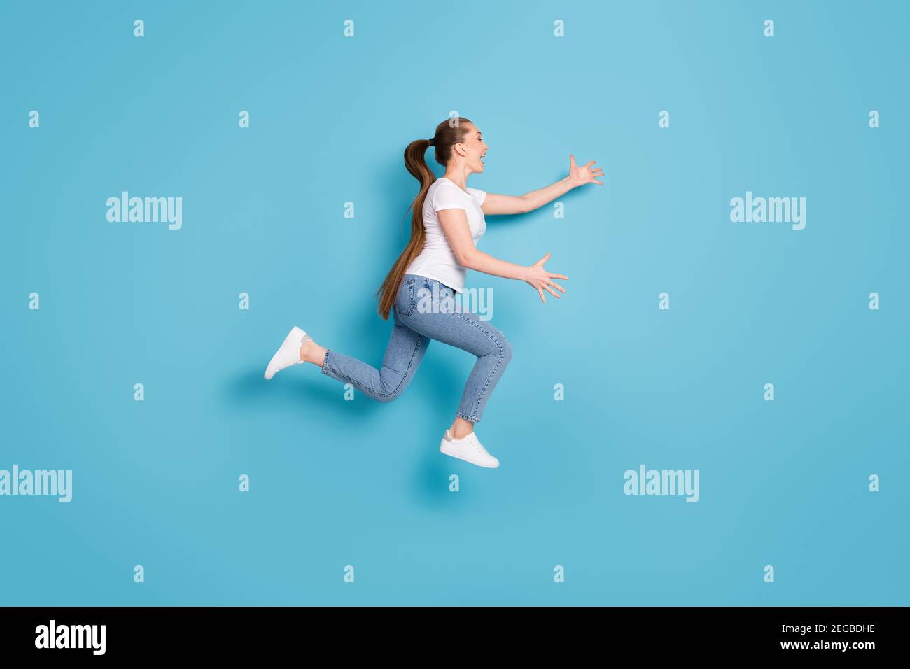 Full length profile side photo of excited energetic girl jump run want ...