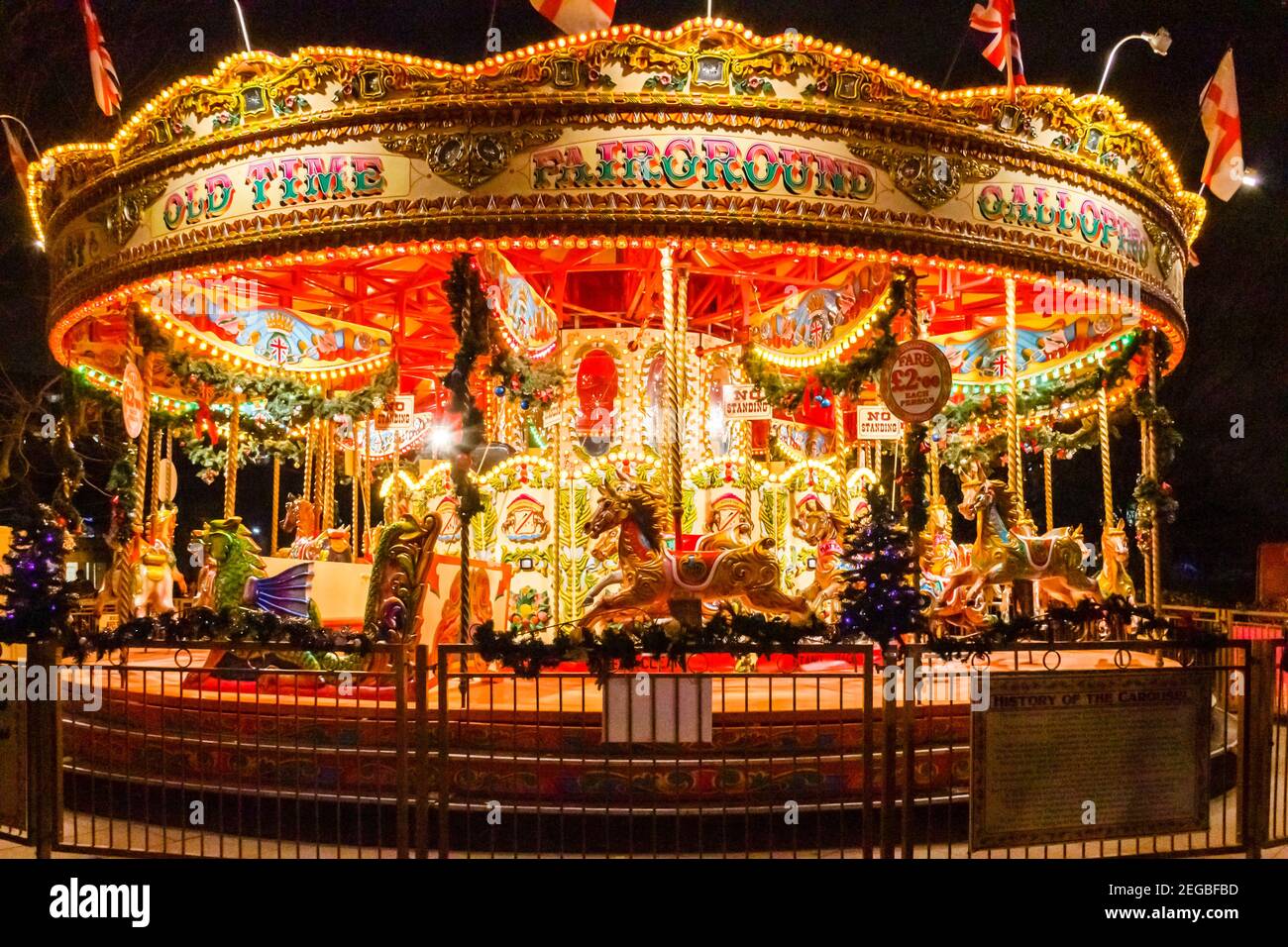 A traditional fairground carousel lit up at night on the South Bank ...