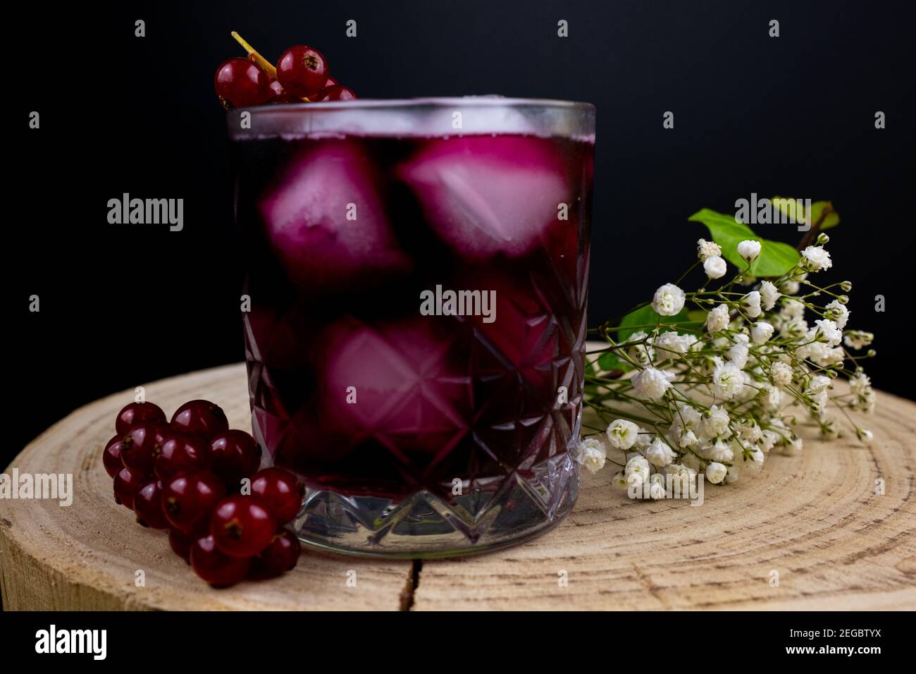glasscurrant berry water dark background, wooden table Stock Photo - Alamy
