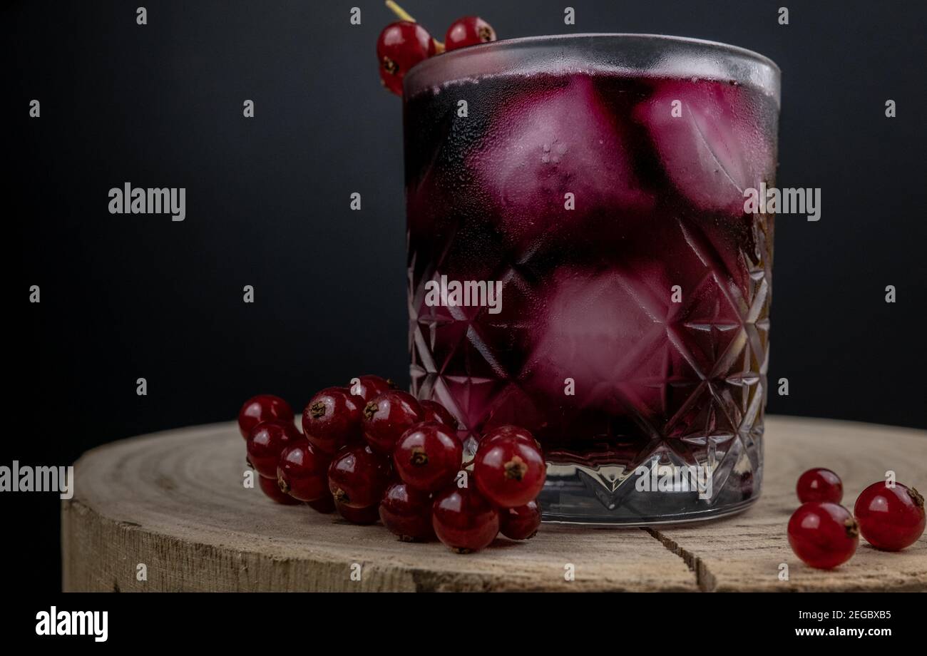 glasscurrant berry water dark background, wooden table Stock Photo - Alamy