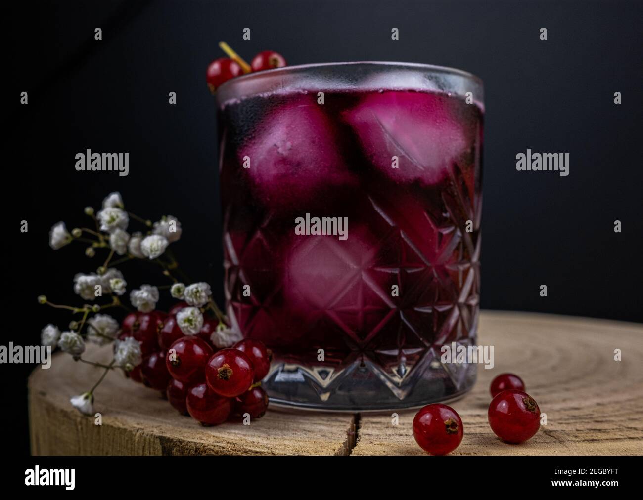 glasscurrant berry water dark background, wooden table Stock Photo - Alamy
