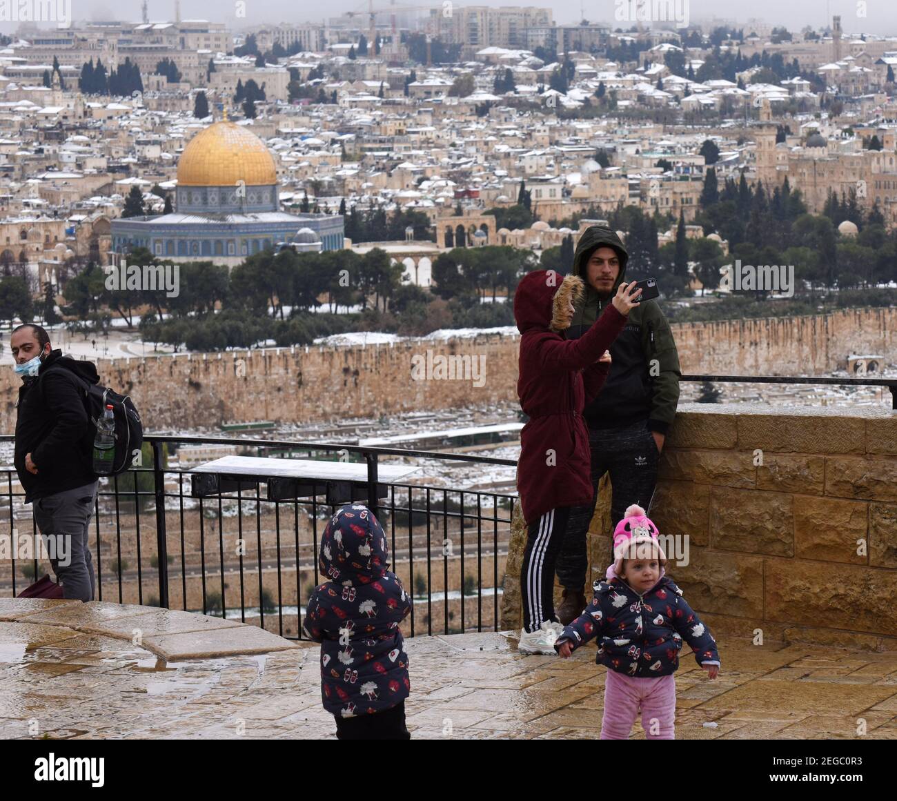 Jerusalem, Israel. 18th Feb, 2021. Palestinians take a selfi with snow ...