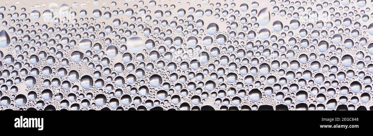 Condensation on the window. Fine drops of water on a pane of glass ...