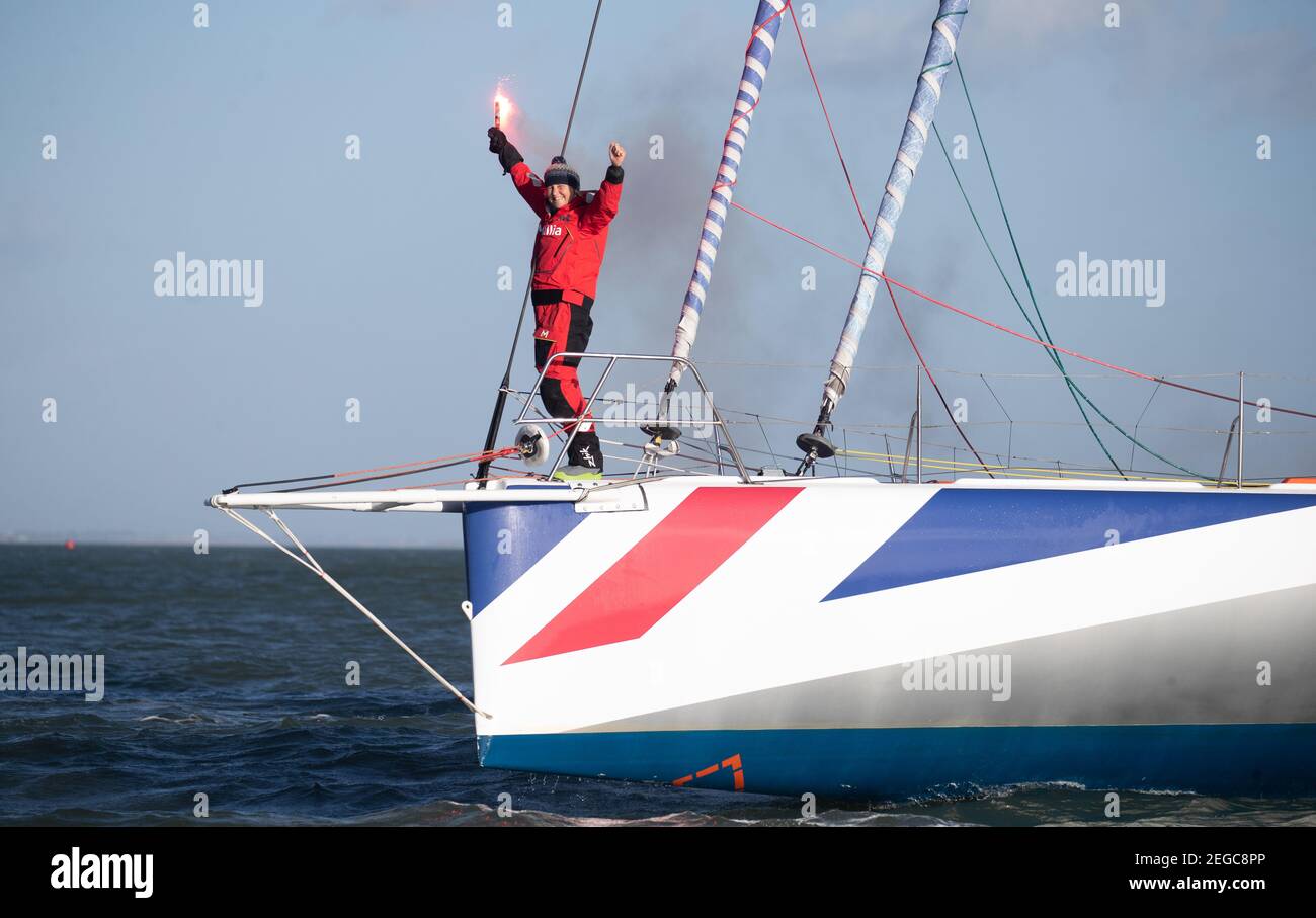 Pip Hare sets off a flare as she sails her boat Medallia into Poole ...