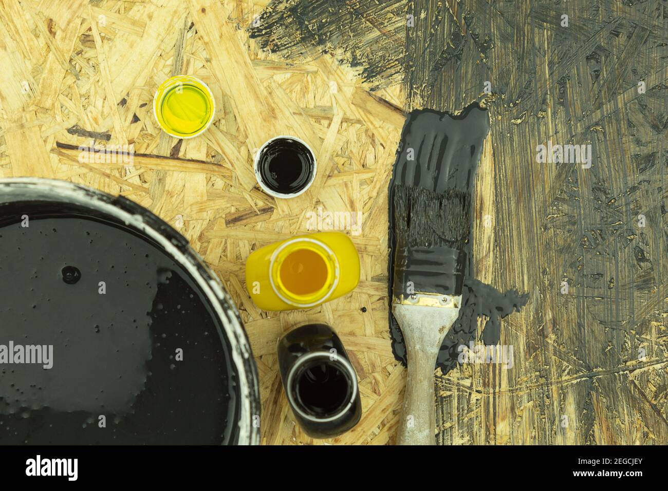 The painter mixes paint and water emulsion. Selection of paint color ...