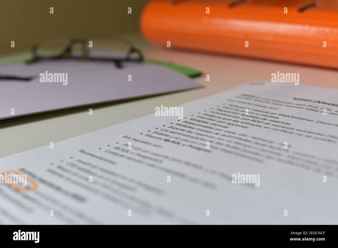 Study table with notes and glasses Stock Photo - Alamy