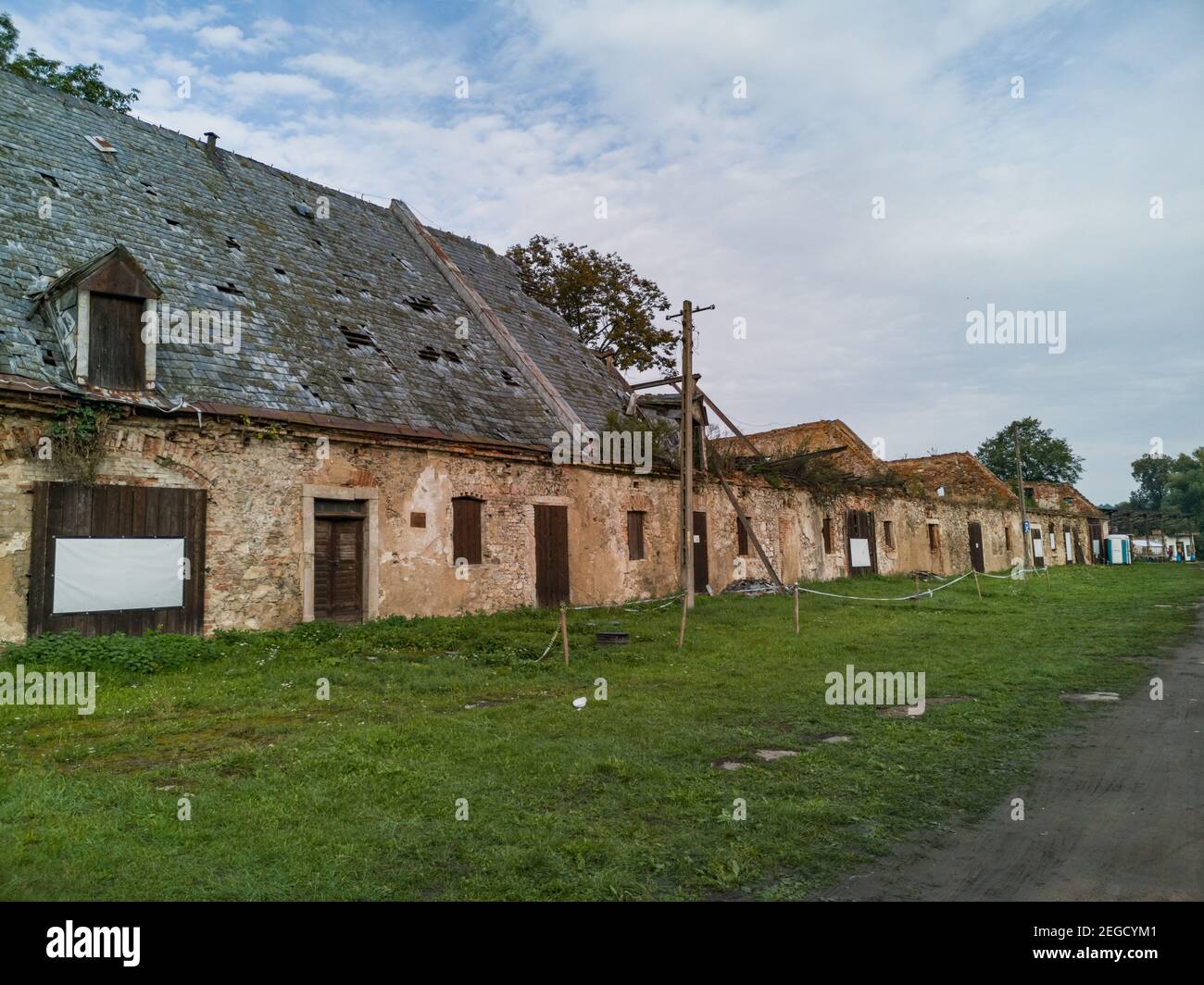 Old ruined barracks in small old village Stock Photo - Alamy