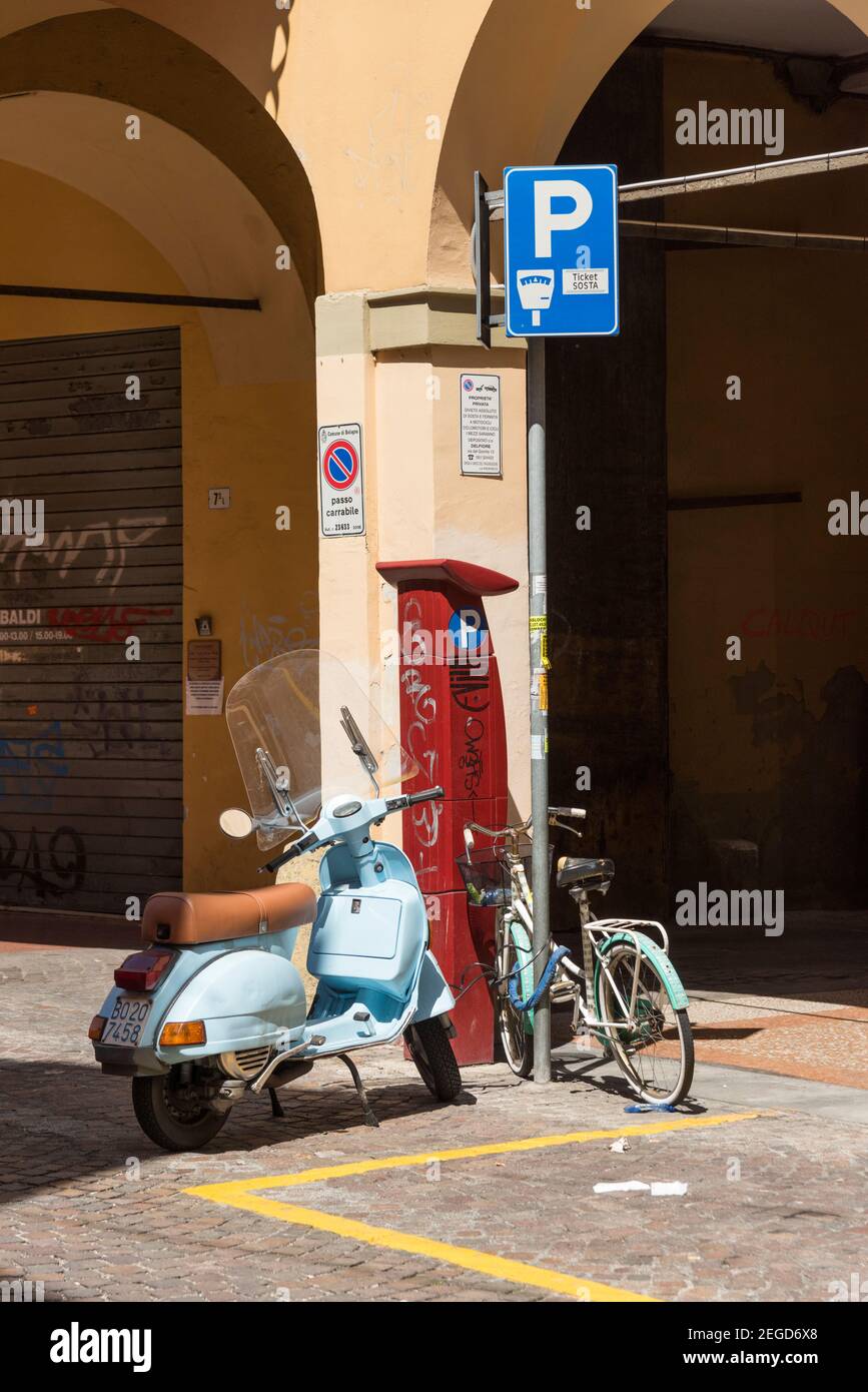 A light blue vespa scooter parked in a street in Bologna Italy Stock ...
