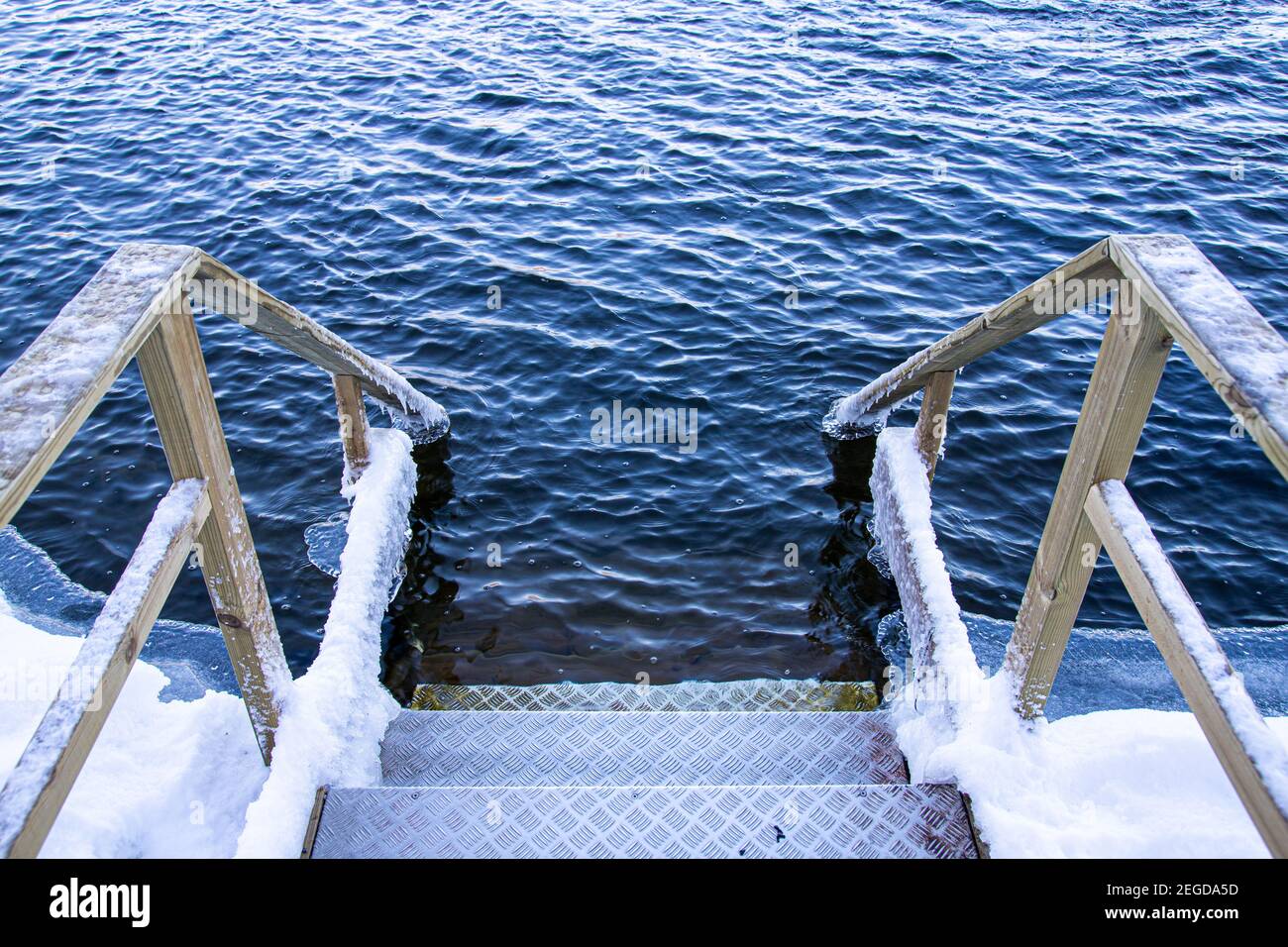High angle shot of a frozen staircase leading to the water Stock Photo ...