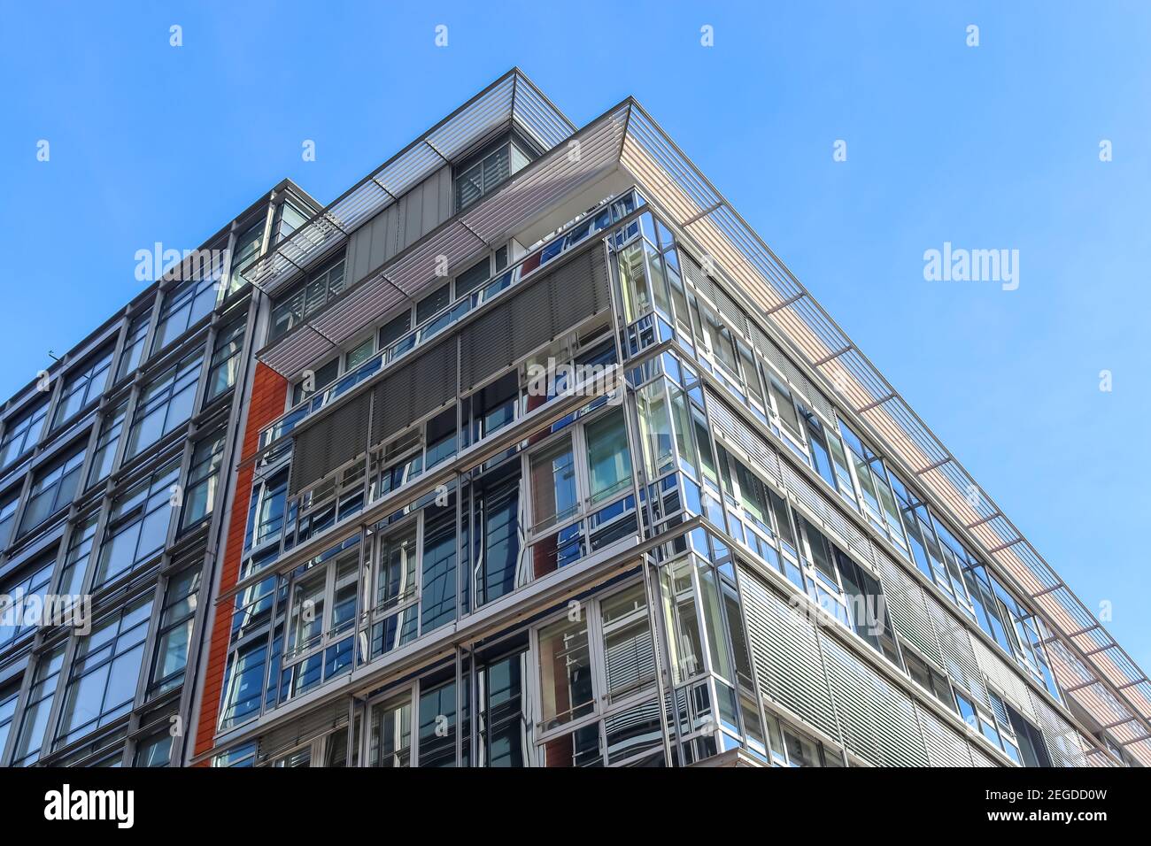 Low angle shot of an angular modern glass building in Kiel, Germany ...