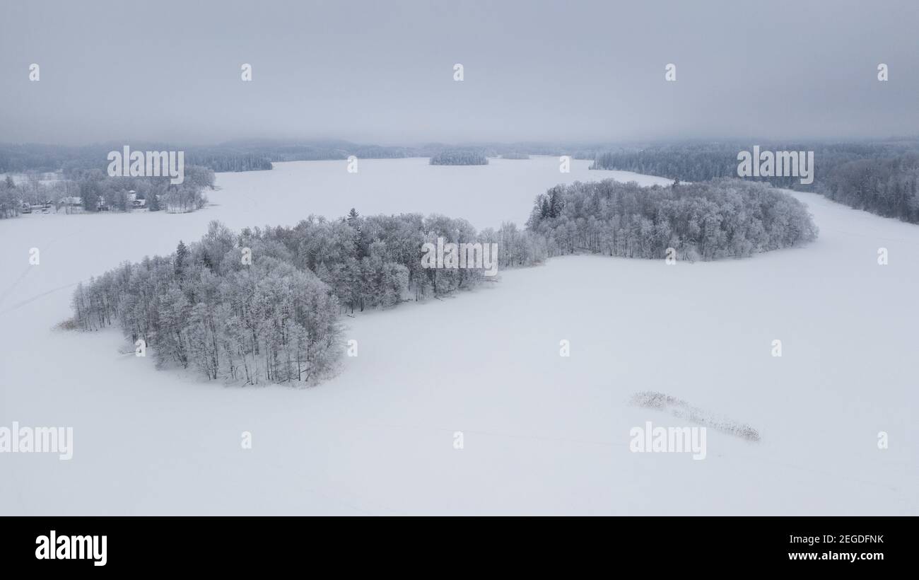 Aerial shot of snow-covered mountains on a winter day Stock Photo - Alamy