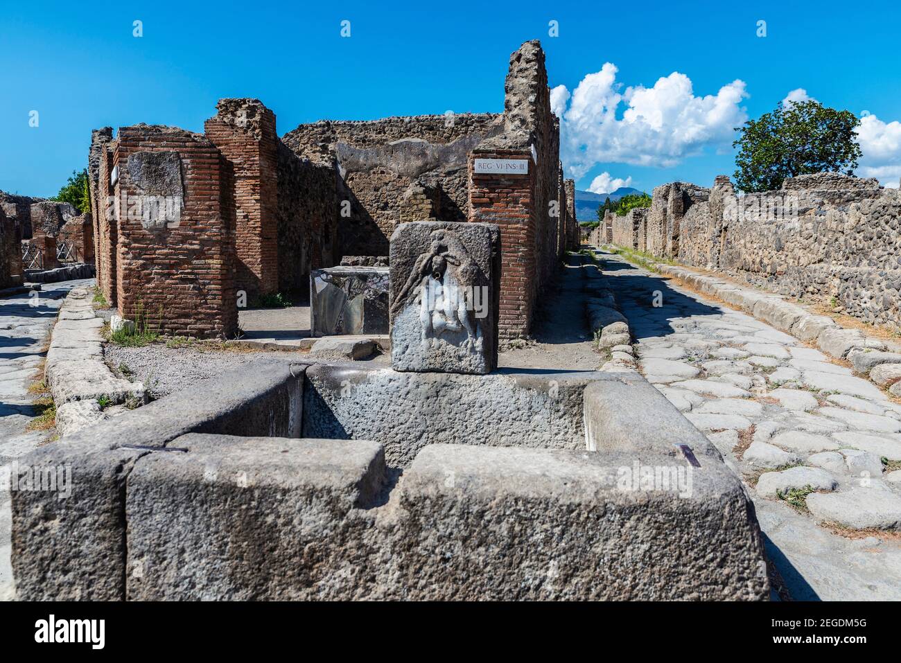 Fountain on a street of the roman ruins of the ancient archaeological ...