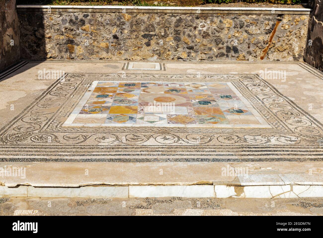 Tiled floor and mosaic in the ruins of the ancient archaeological site ...