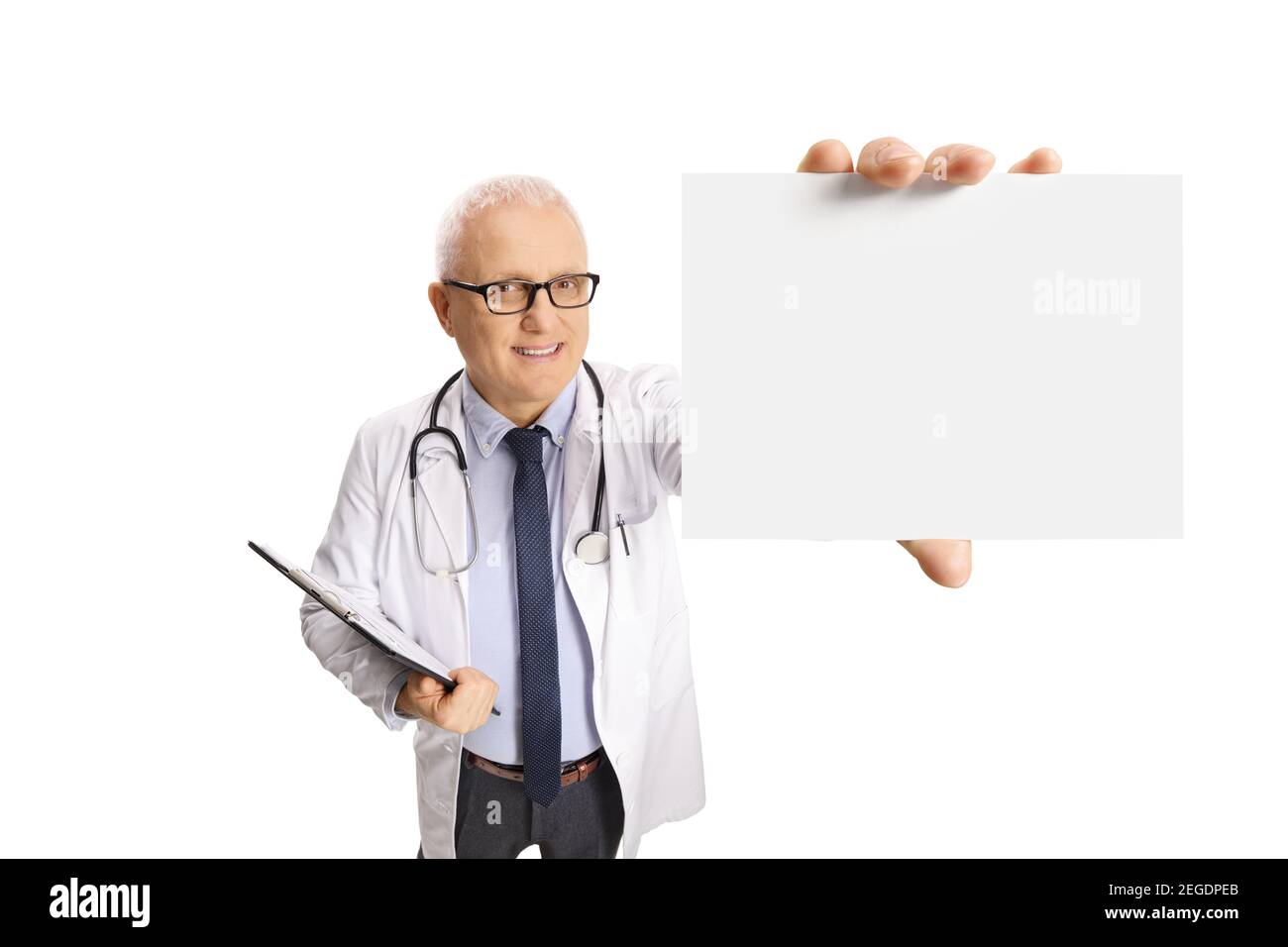 Mature doctor holding a blank card isolated on white background Stock ...