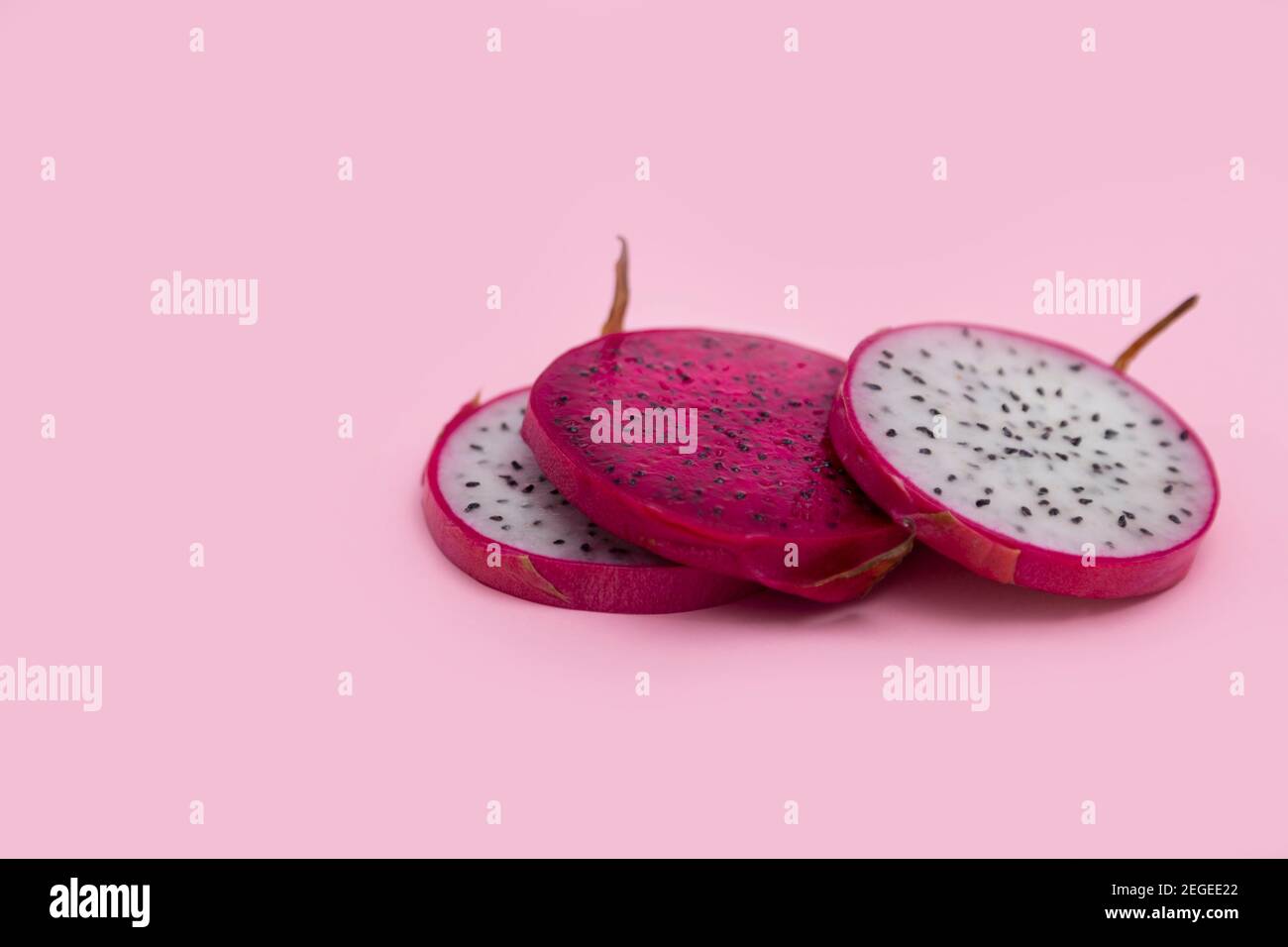 Red and pink dragon fruit slice with red and white flesh. The pitahaya ...
