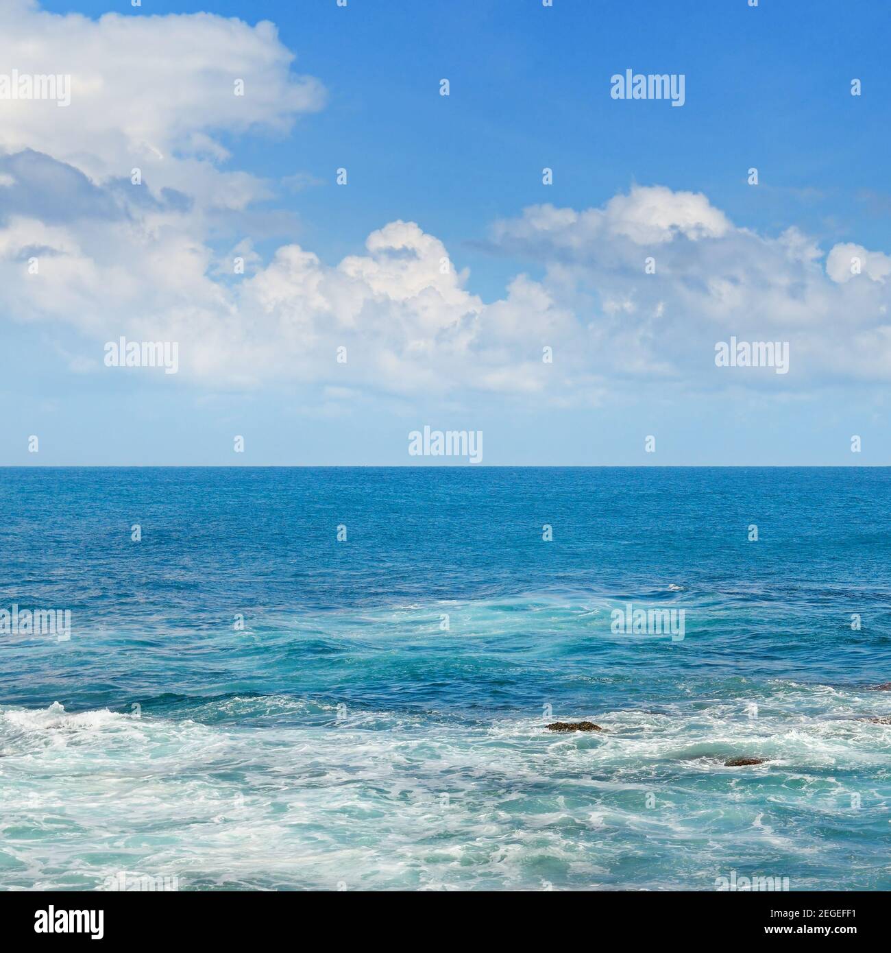 Tropical ocean, beach, high waves and blue sky Stock Photo - Alamy