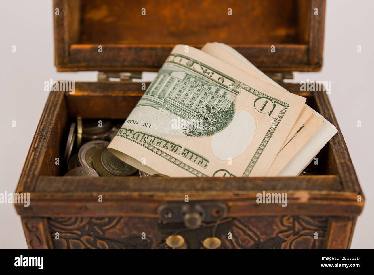 paper money dollars in a wooden chest Stock Photo - Alamy