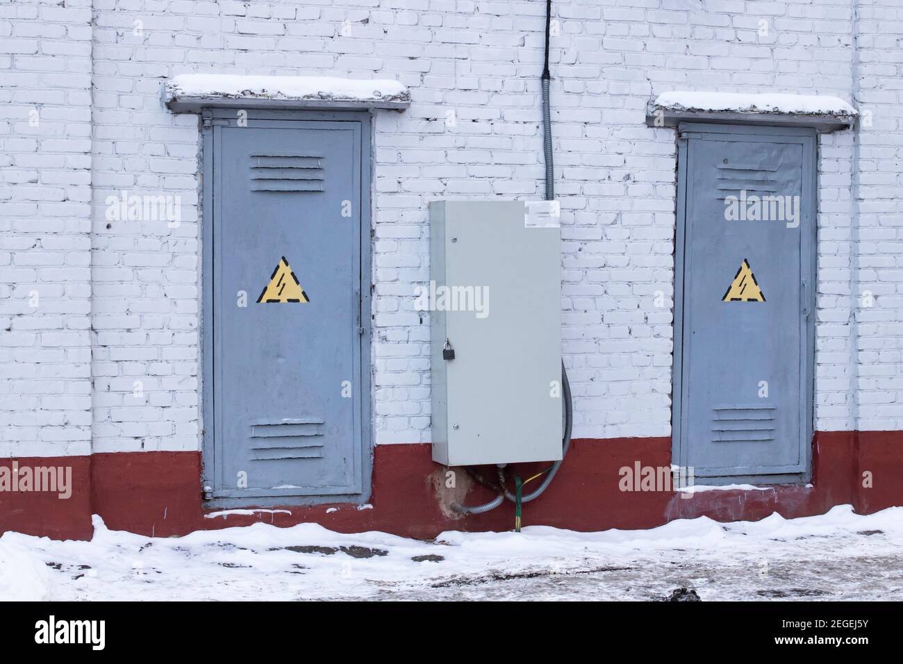Doors on the transformer booth with danger signs close up Stock Photo ...
