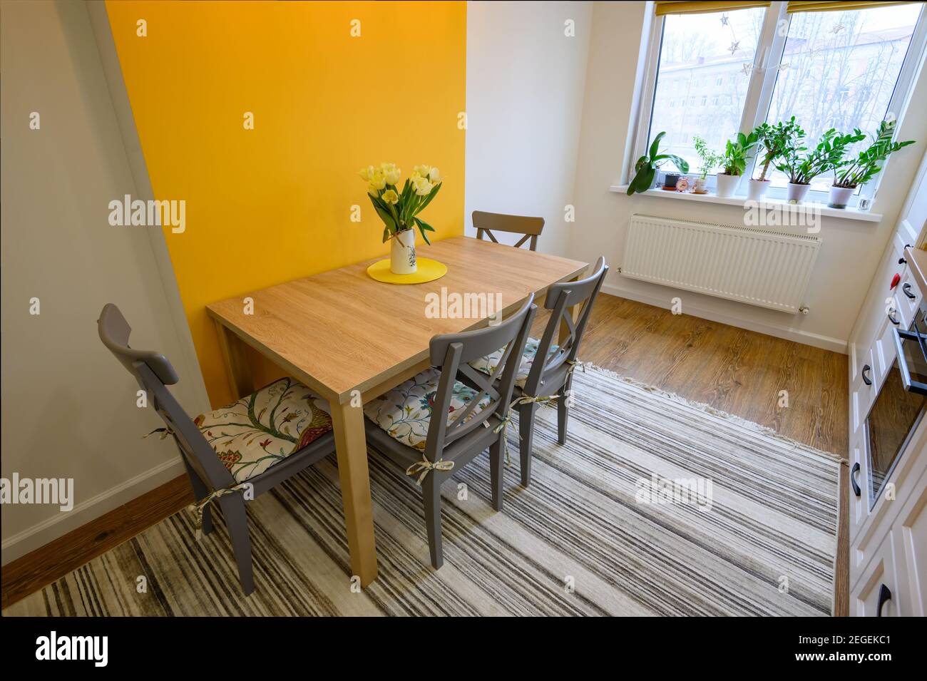 dining table in cozy well designed dining room Stock Photo - Alamy