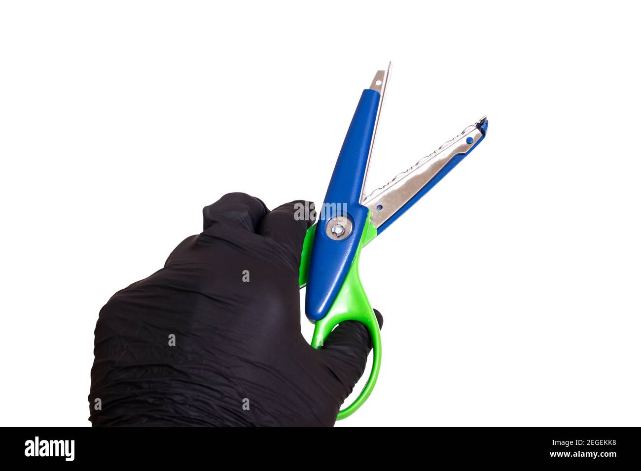 Bright scissors for cutting patterns in hand isolated on a white ...