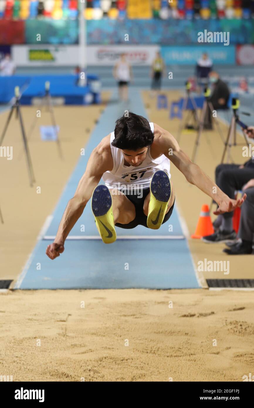 ISTANBUL, TURKEY - FEBRUARY 06, 2021: Undefined athlete long jumping ...