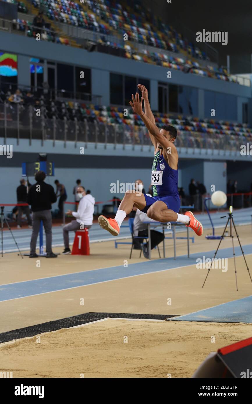 ISTANBUL, TURKEY - FEBRUARY 06, 2021: Undefined athlete long jumping ...