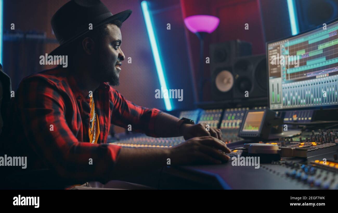 Stylish Male Audio Engineer Working in Music Recording Studio, Uses ...