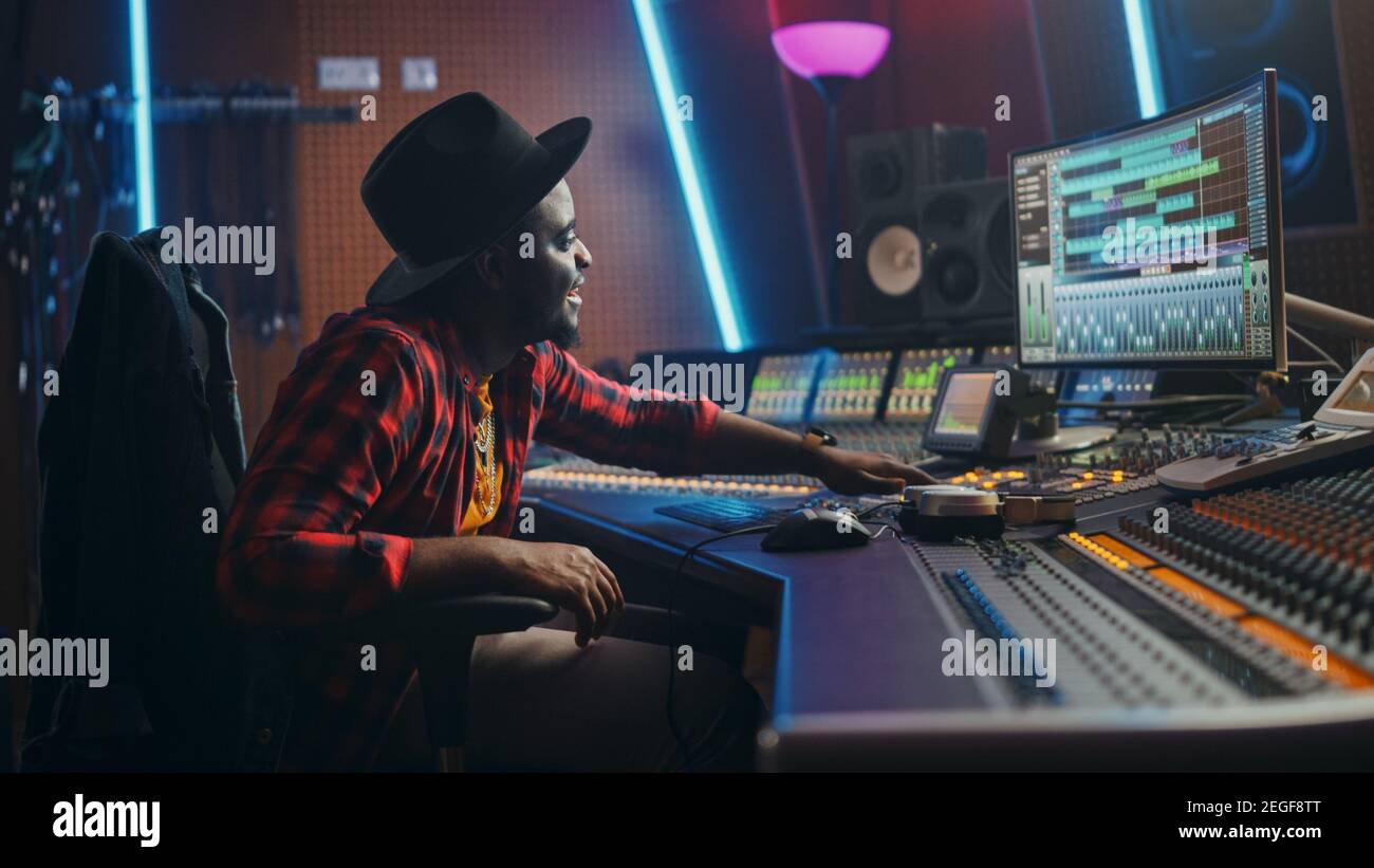 Portrait of Audio Engineer Working in Music Recording Studio, Uses ...