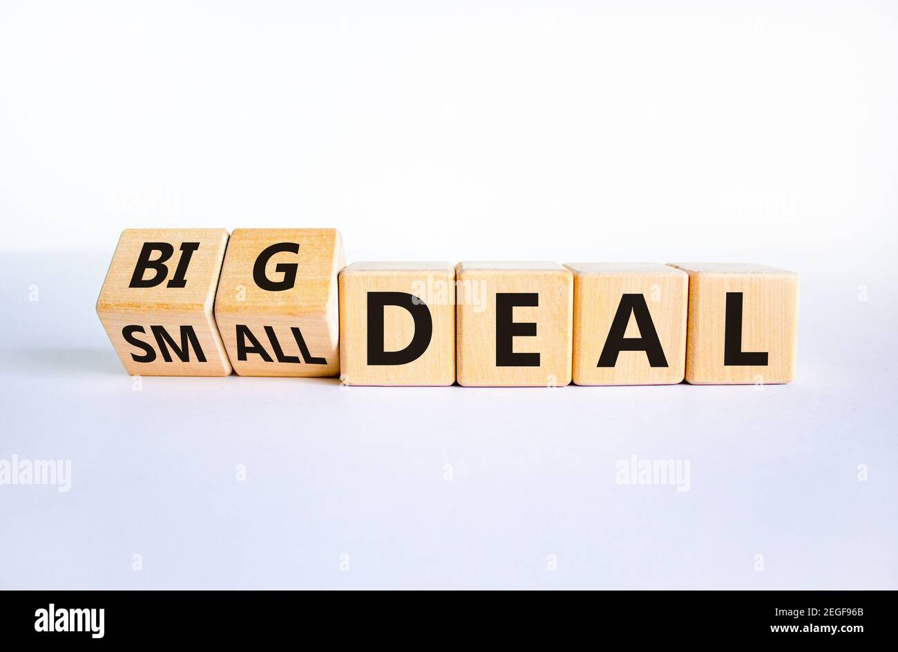 Big or small deal symbol. Turned wooden cubes and changed words 'small ...