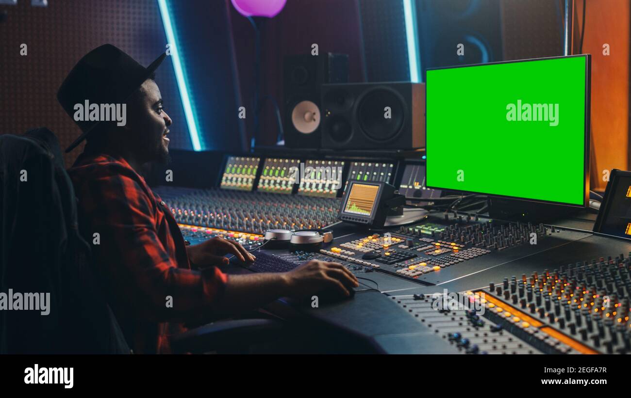 Stylish Audio Engineer Producer Working in Music Record Studio, Uses ...